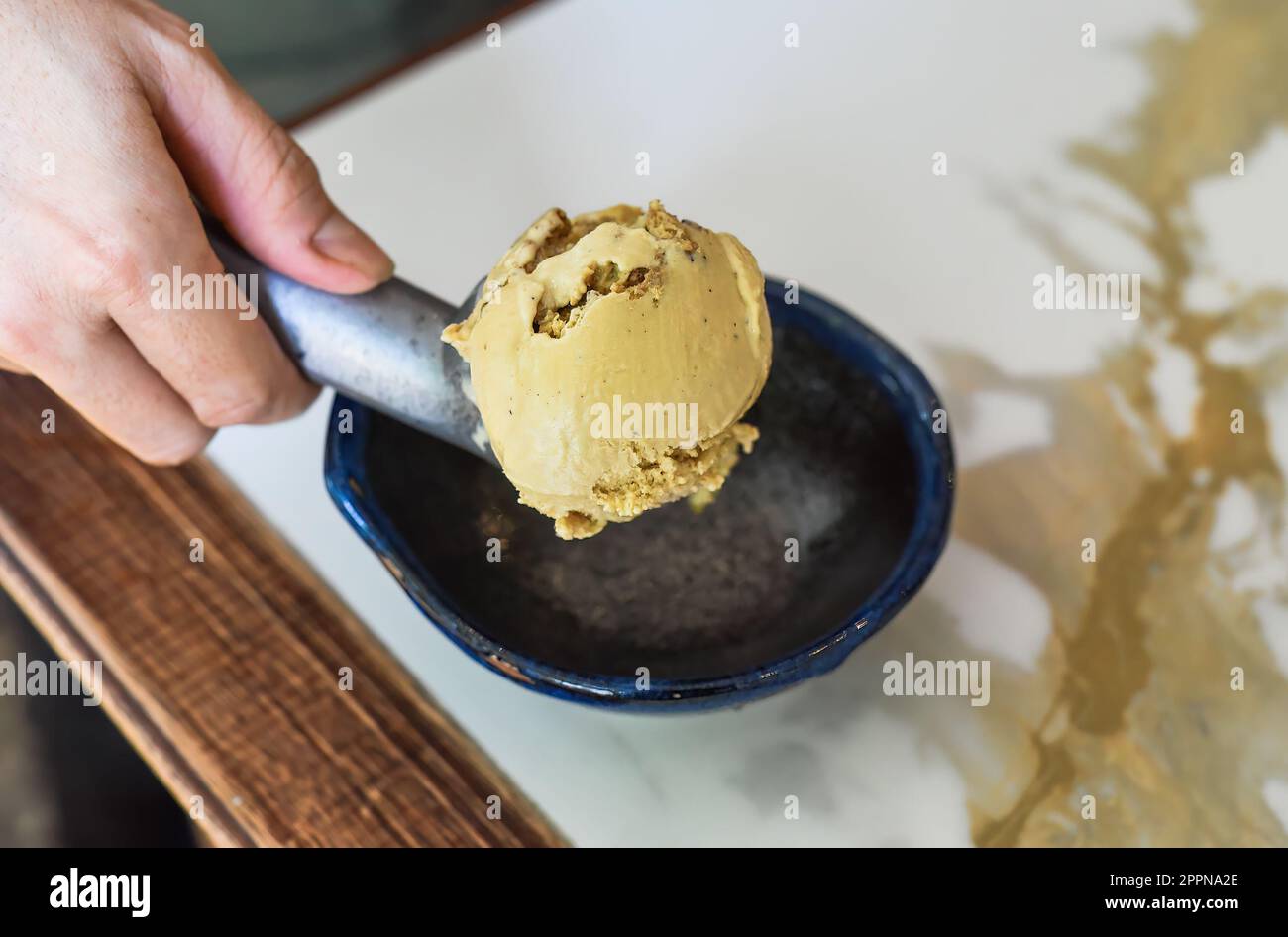 Hand scooping chocolate tiramisu ice hi-res stock photography and images - Alamy