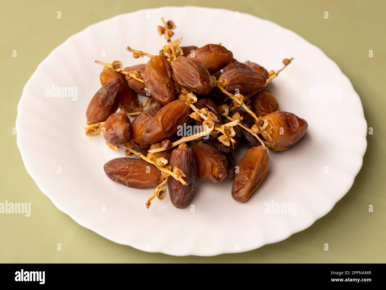 Dates or dattes palm fruit in white bowl is snack healthy, Set of ...