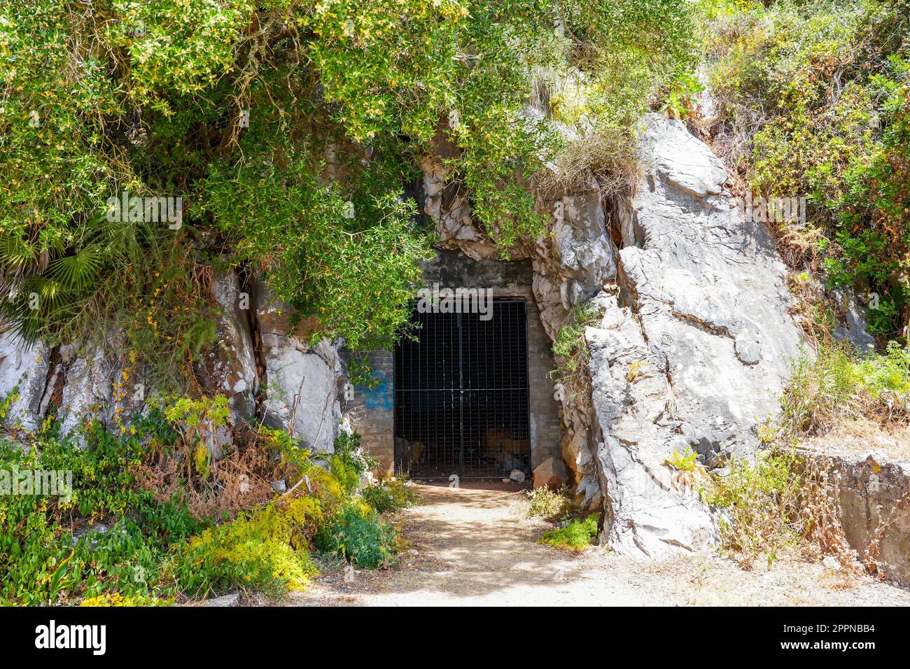 Entrance to a cave located on the mountain at the top of the Rock of ...