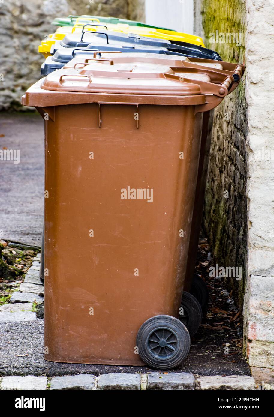 Row of garbage cans hi-res stock photography and images - Alamy
