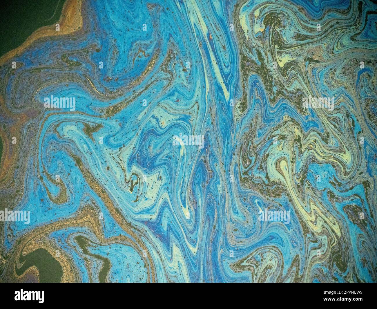 oil spreading on sea surface Aerial top down view like a abstract ...