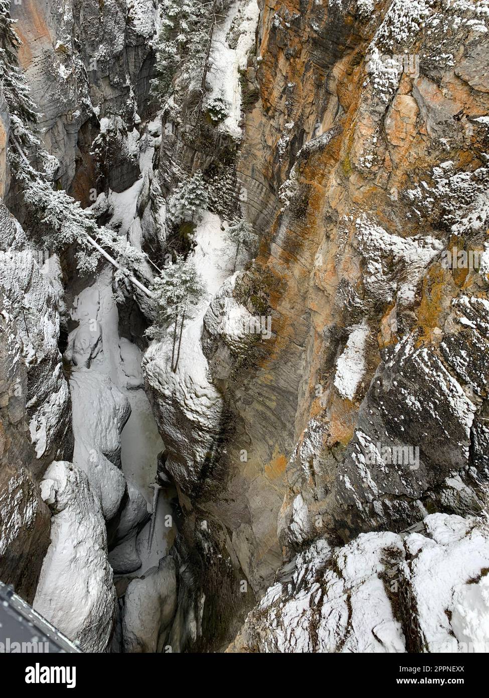 Aerial view of pristine winter landscape featuring snow covered rocky ...