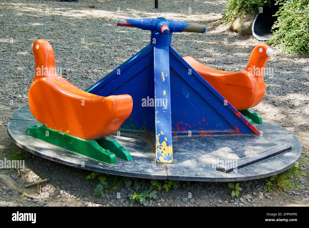 Carousel with birds at a playground for children on the danish island Bornholm Stock Photo - Alamy