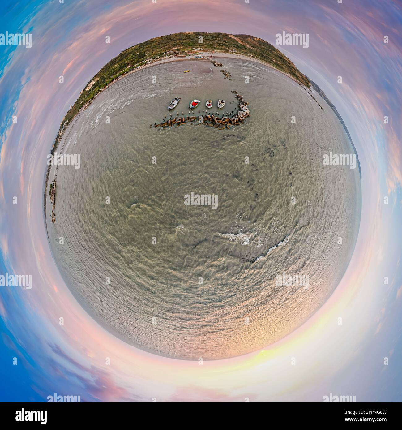 Tiny planet of coast in sunset above sea by village Karpen in Albania ...