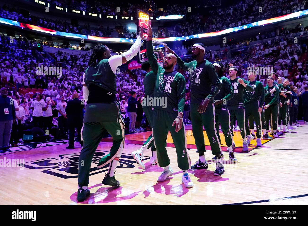 Milwaukee Bucks players high-five before Game 3 in a first-round NBA ...