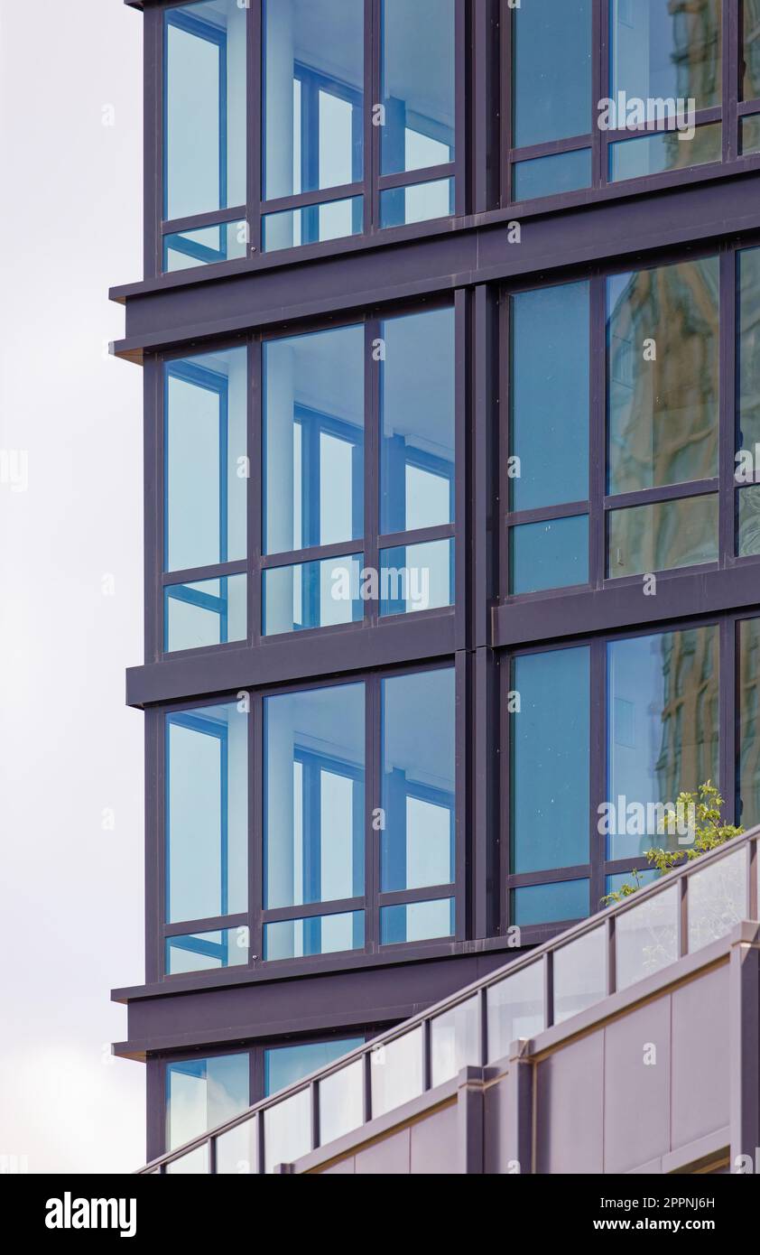 Two Blue Slip is a brick and glass tower capped by curved-façade ...