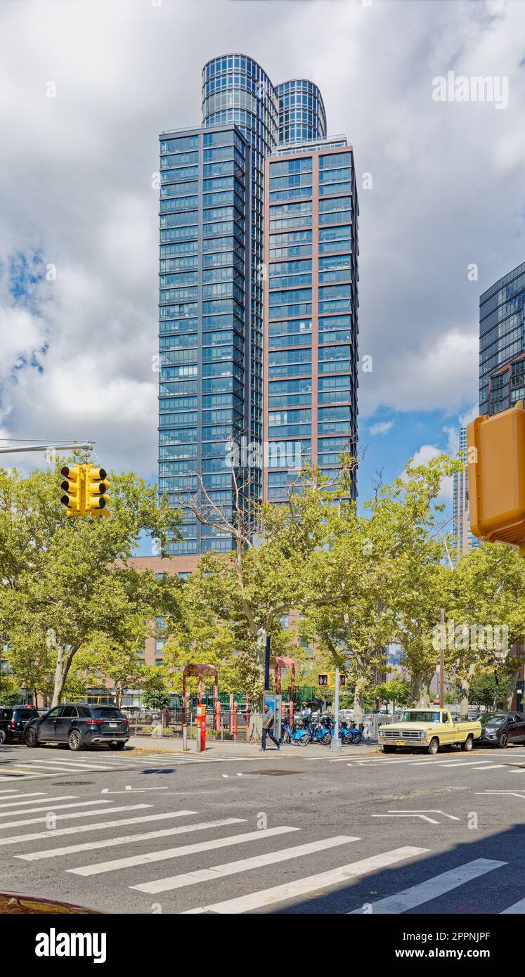 Two Blue Slip is a brick and glass tower capped by curved-façade ...