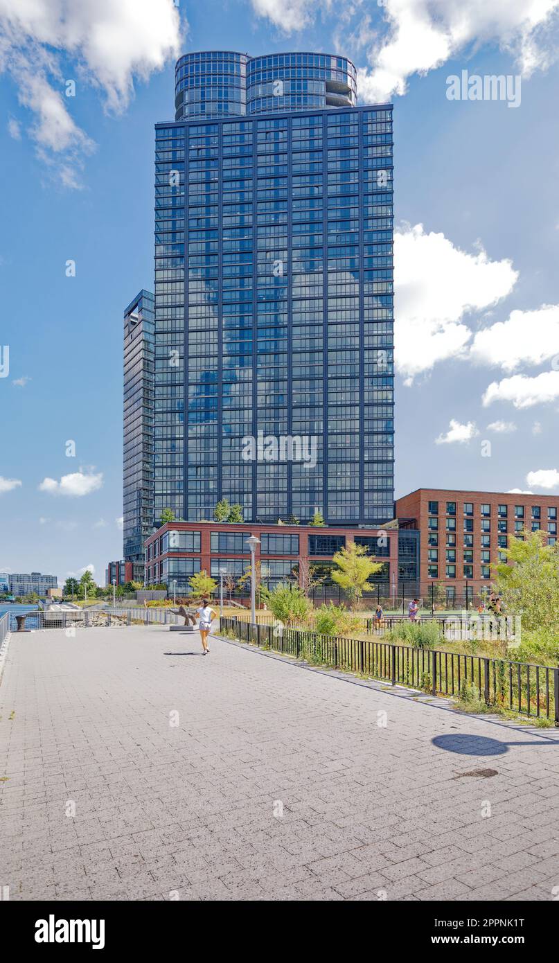 Two Blue Slip is a brick and glass tower capped by curved-façade ...