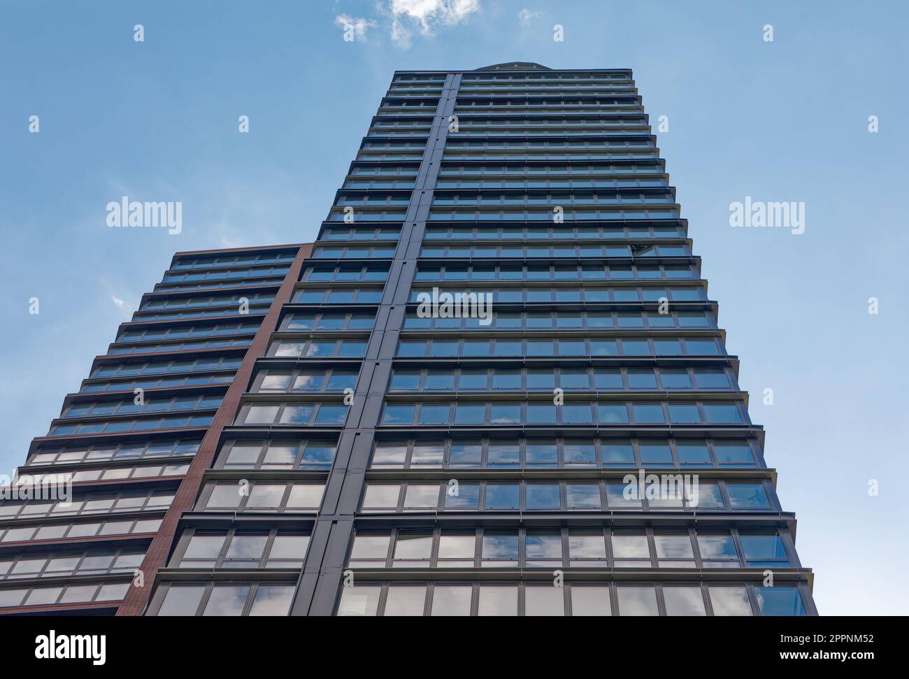 Two Blue Slip is a brick and glass tower capped by curved-façade ...