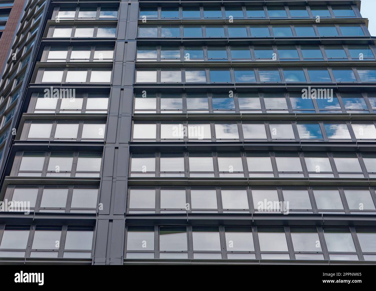 Two Blue Slip is a brick and glass tower capped by curved-façade ...