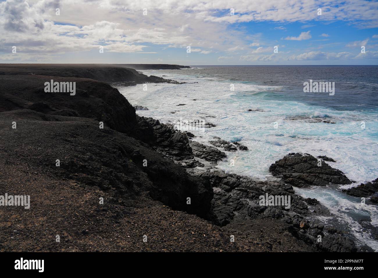 Sea cliffs of the Jandia Natural Park as seen from Punta Pesebre ...