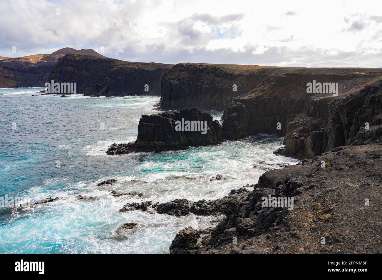 Sea cliffs of the Jandia Natural Park as seen from Punta Pesebre ...