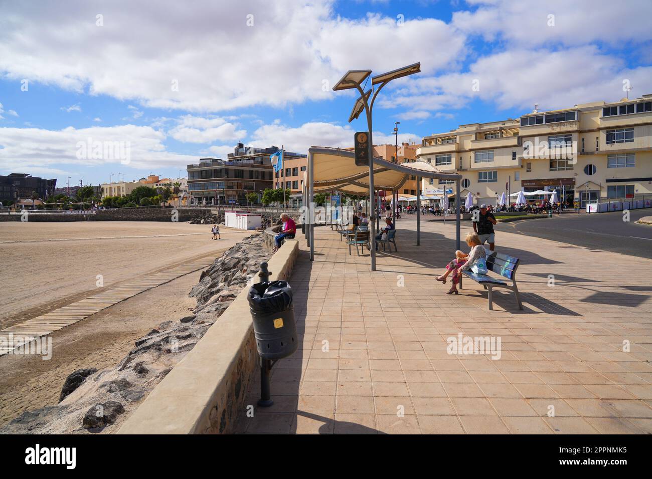 Shaded bus stop on the seafront promenade of Puerto del Rosario, the ...