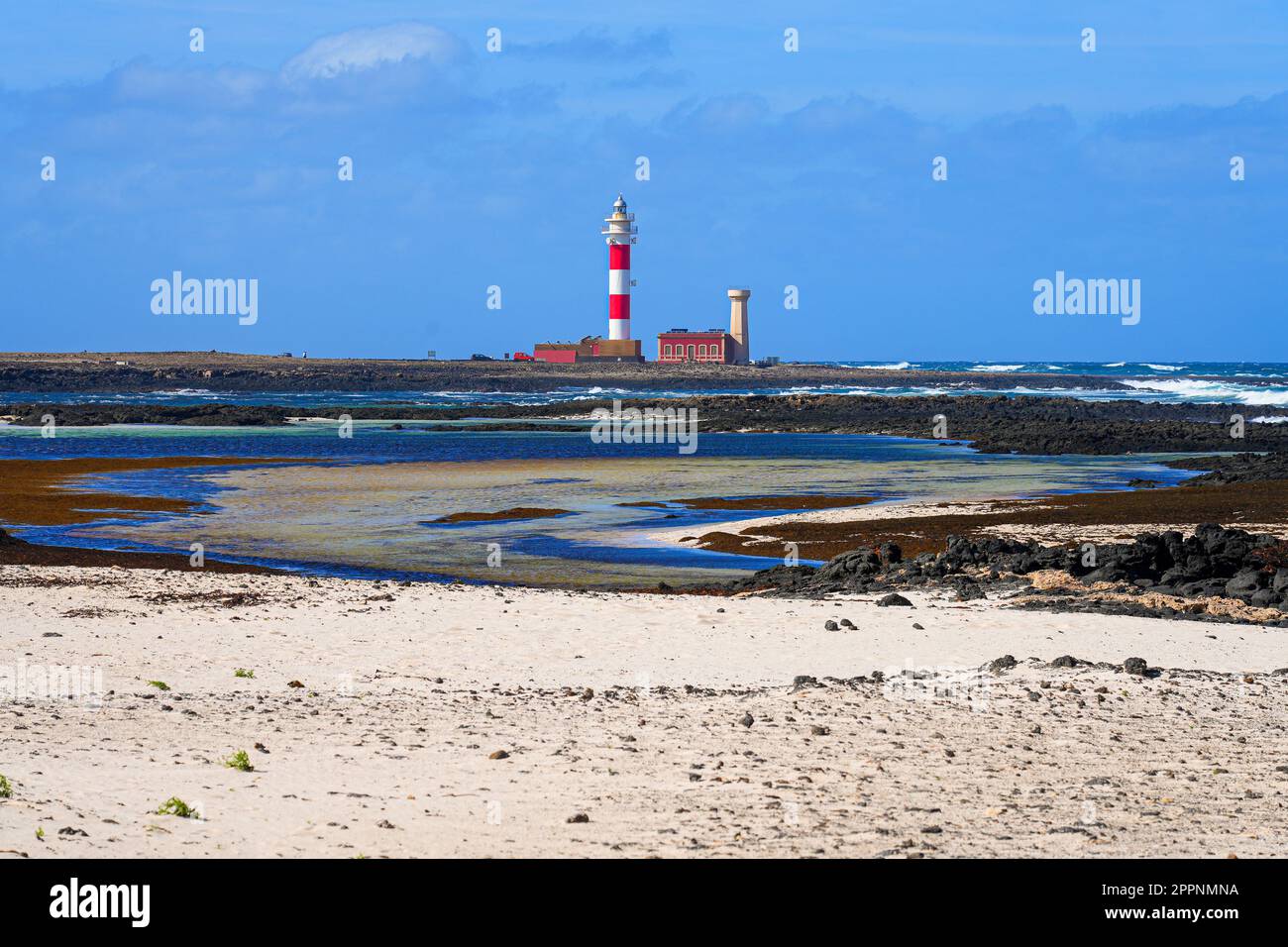 Shallow lagoon along the Atlantic coast with a view over the lighthouse ...