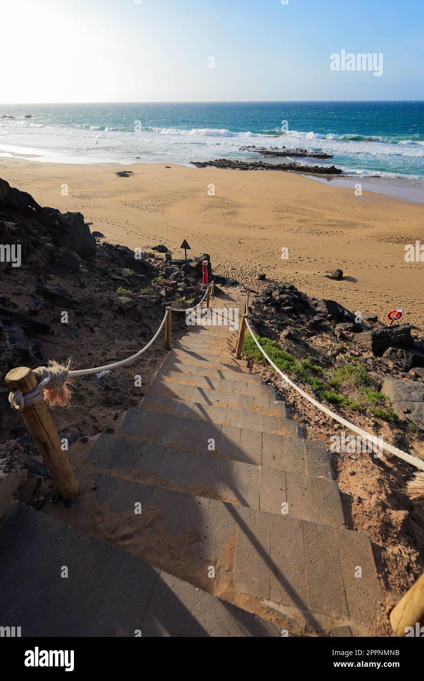 Concrete stairs built on a cliff descending to the Playa de la Escalera ...