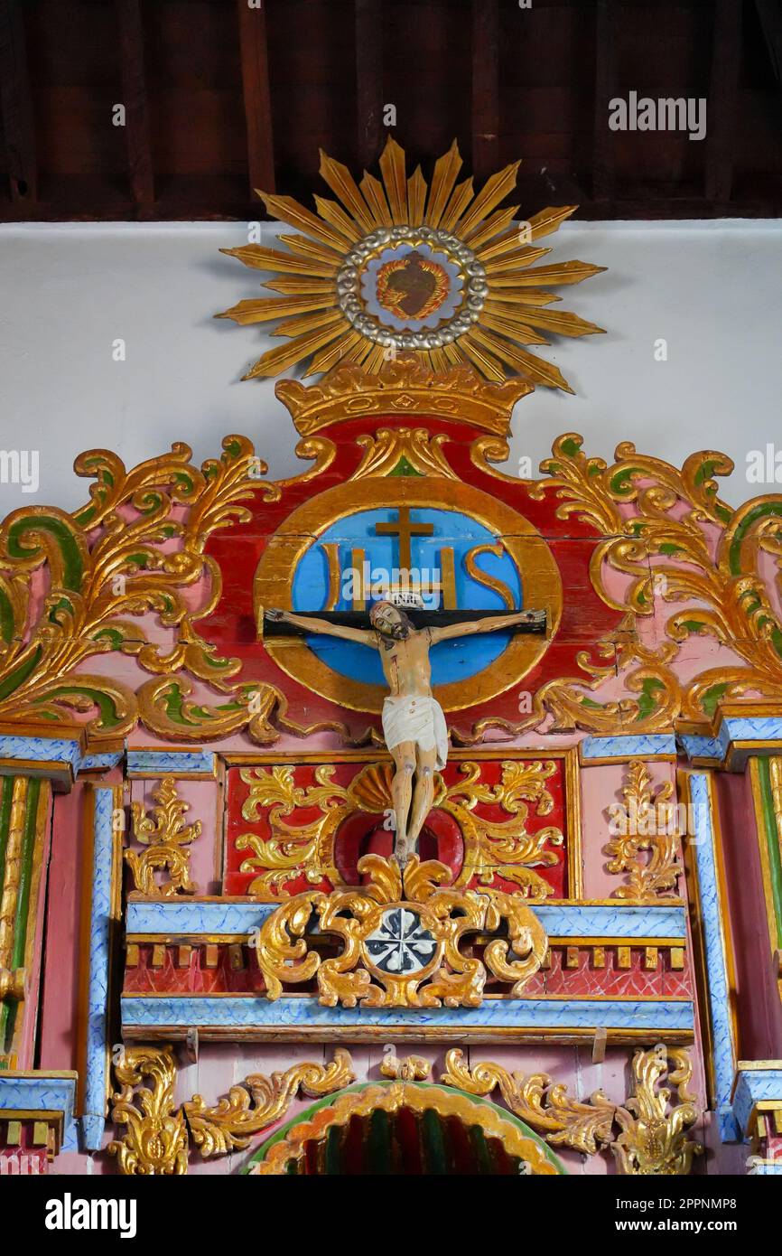 Jesus Christ on the cross of the wooden polychromic altarpiece inside ...