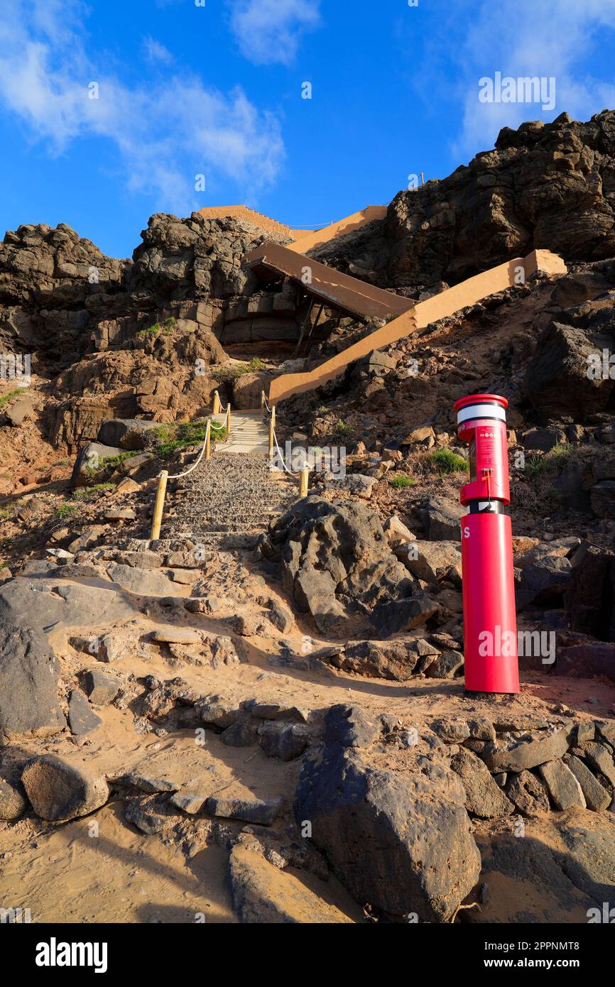 Stairs climbing the rocky cliffs encircling the Playa de la Escalera ...