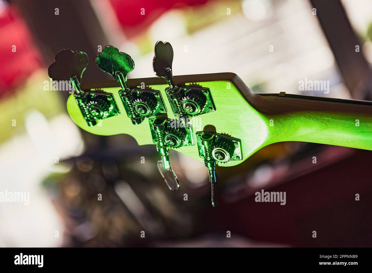 A close-up photo of a black bass guitar pick on a white background ...