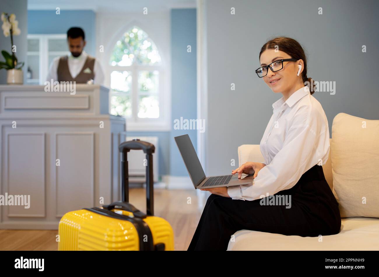 Reception counter woman manager sitting hi-res stock photography and ...