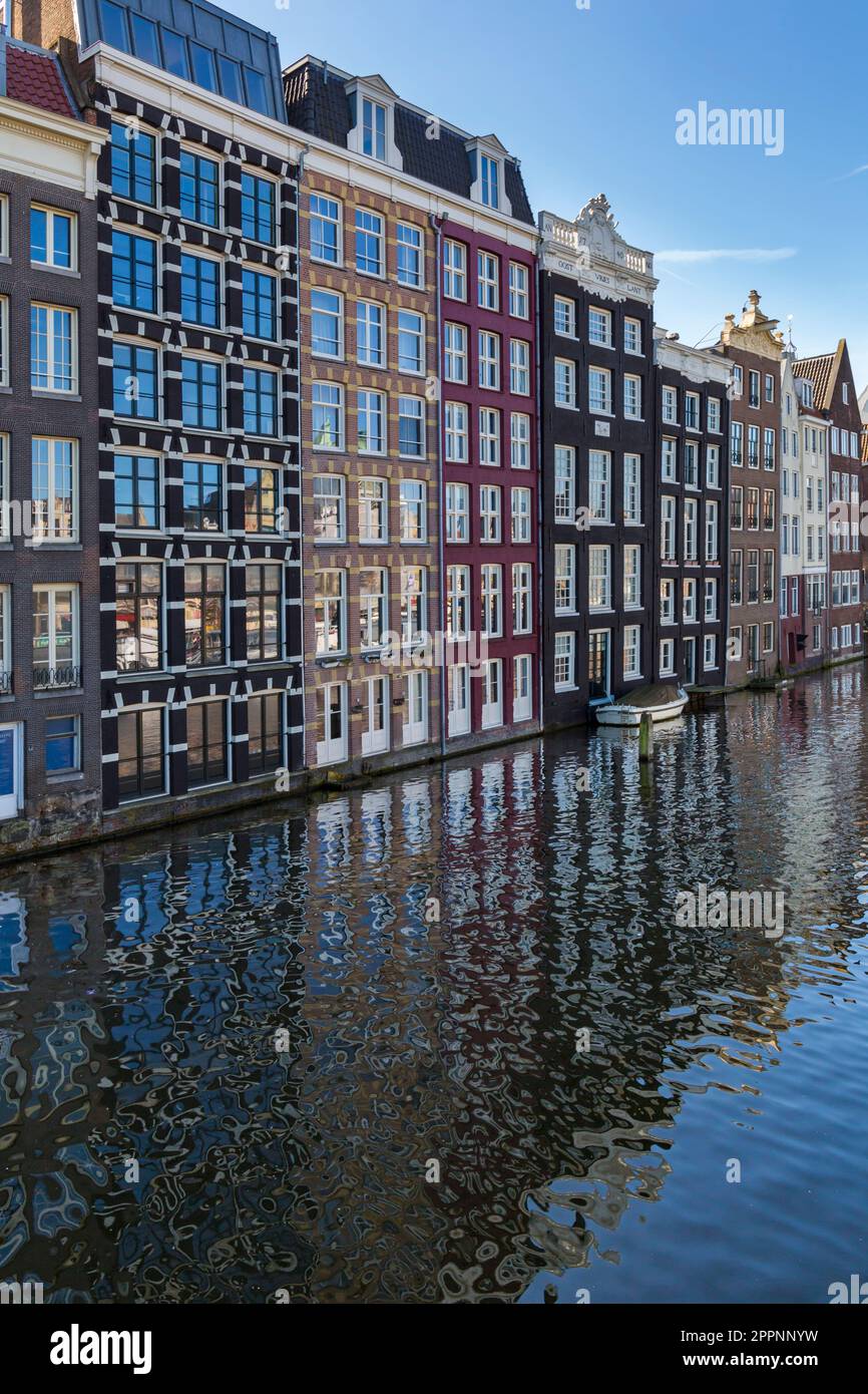 Dancing houses, buildings with reflections in windows by Damrak canal ...