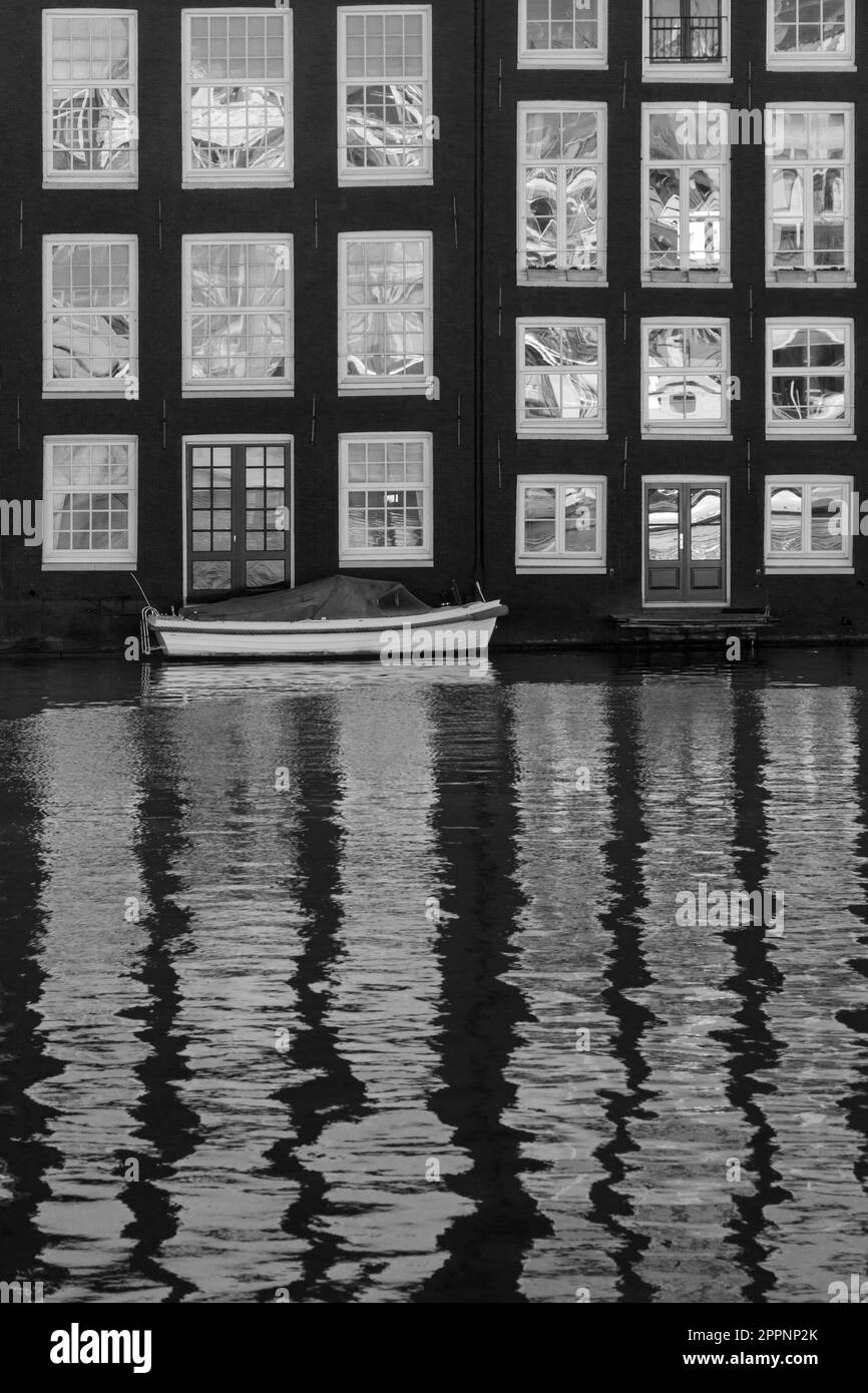 Dancing houses, buildings with reflections in windows by Damrak canal ...