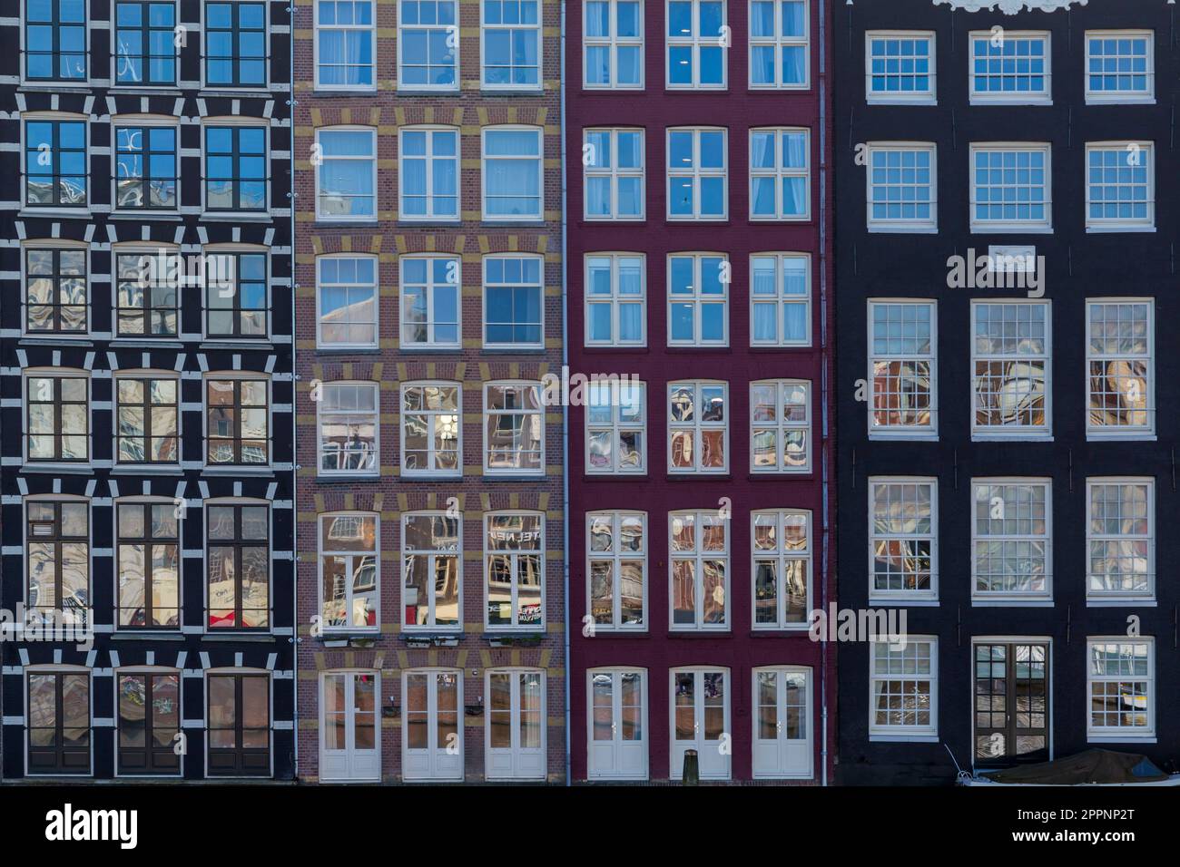 Dancing houses, buildings with reflections in windows by Damrak canal ...