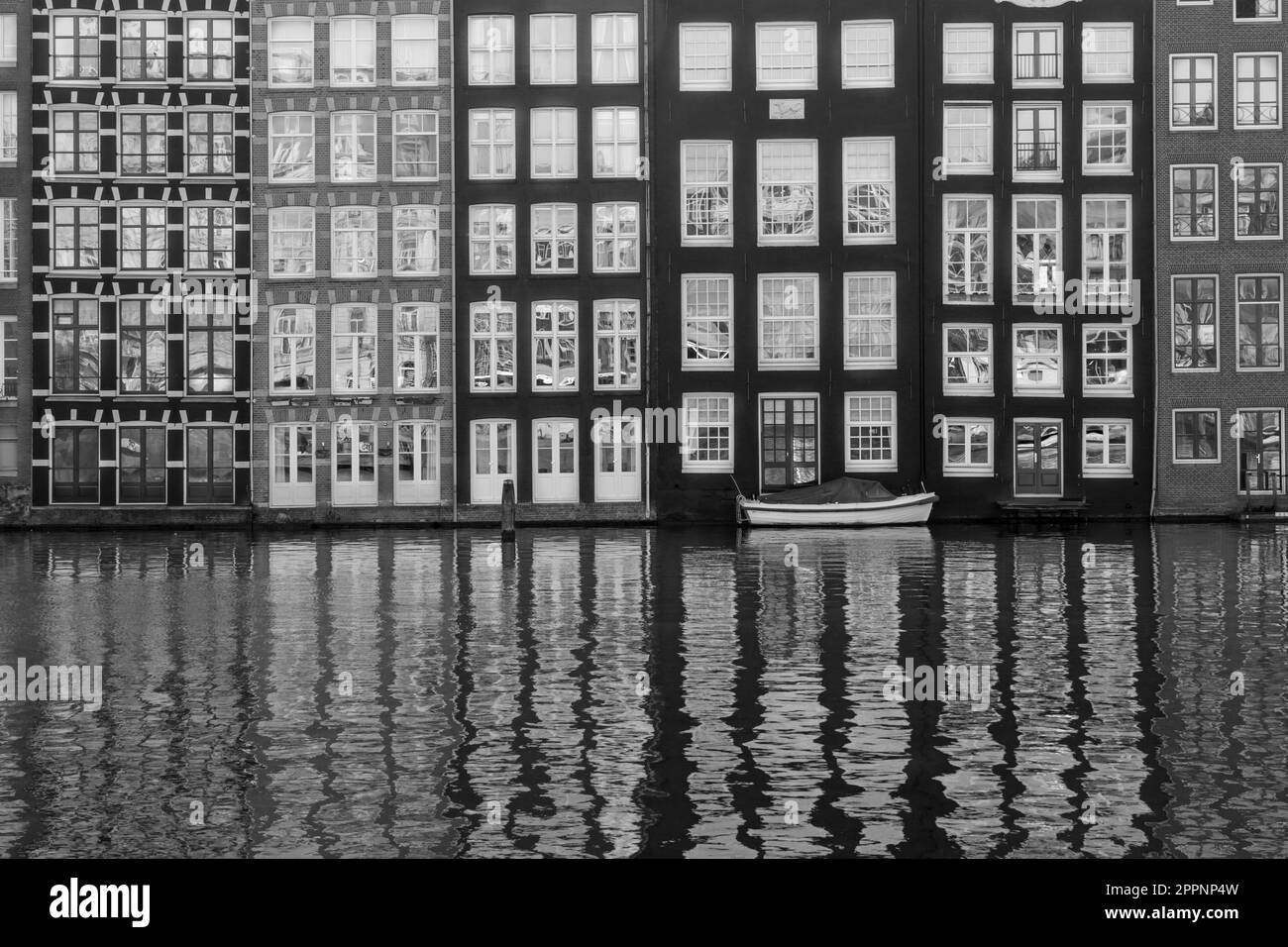 Dancing houses, buildings with reflections in windows by Damrak canal ...