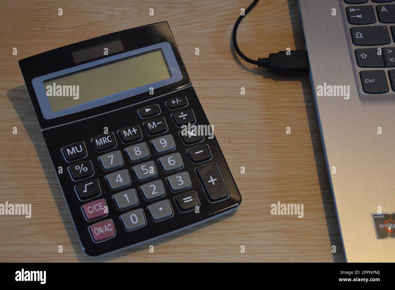 Calculator on table with office supplies Stock Photo - Alamy