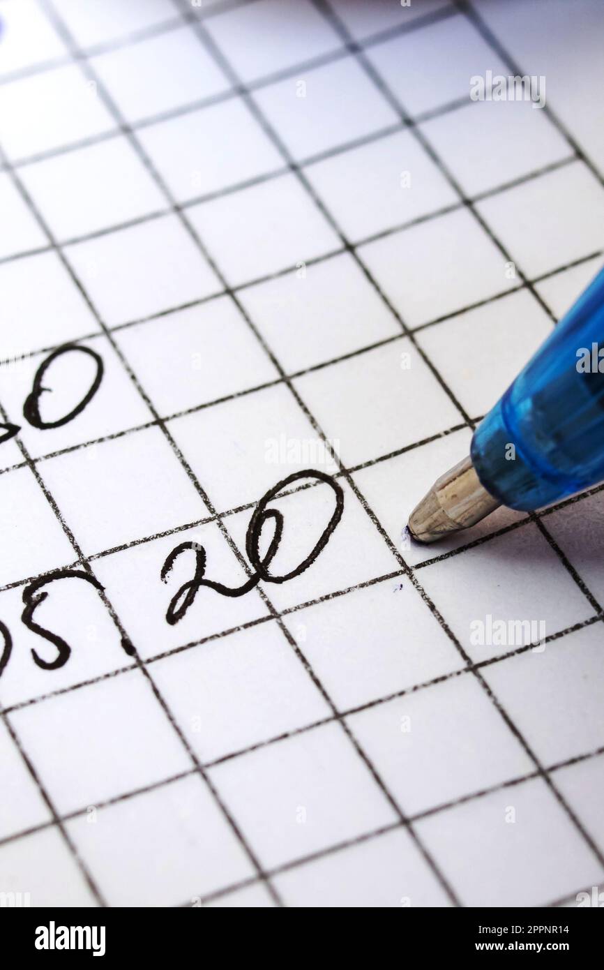 Writing date with pen on white paper close up Stock Photo - Alamy