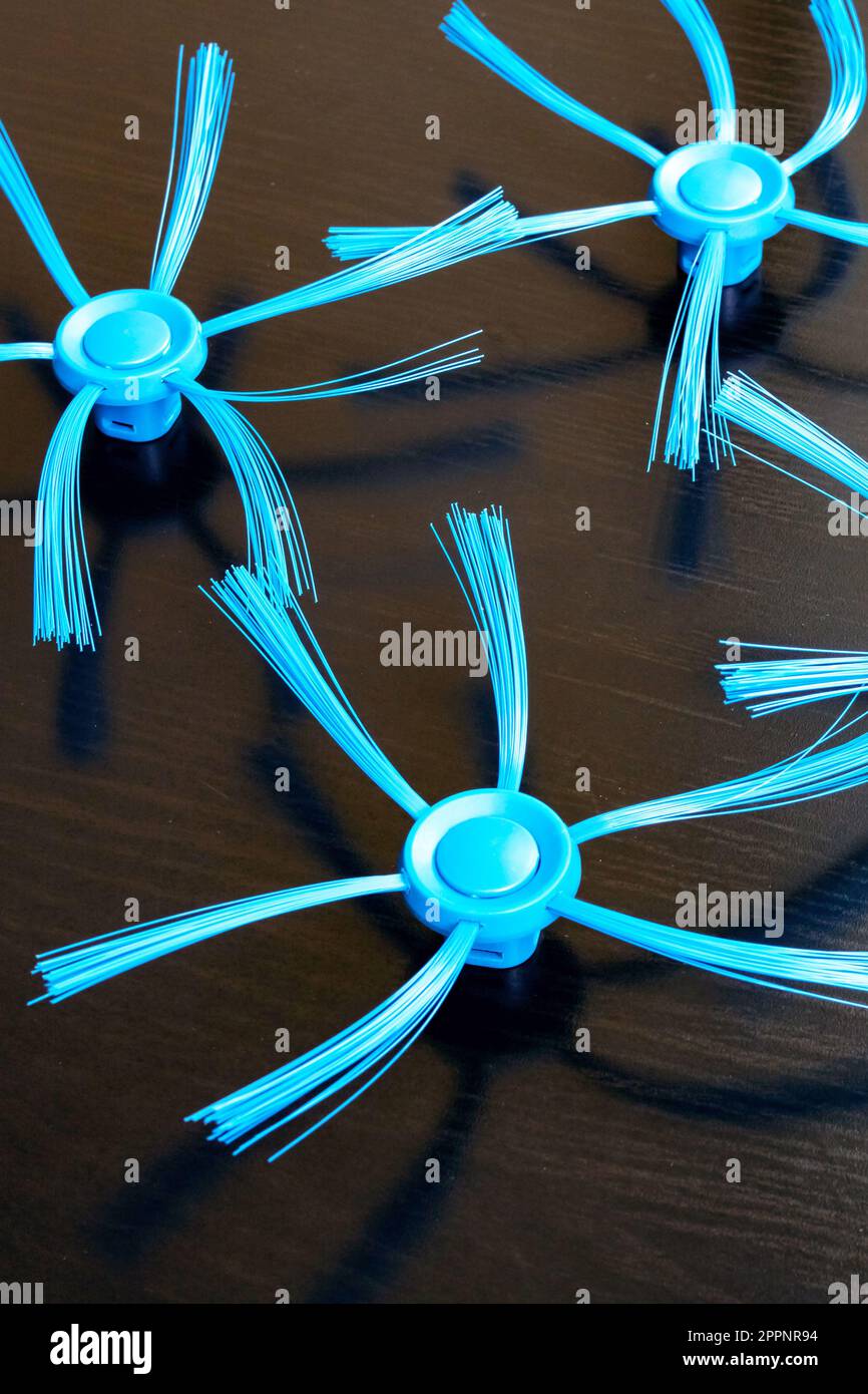Blue brushes for the robot vacuum cleaner close up Stock Photo - Alamy