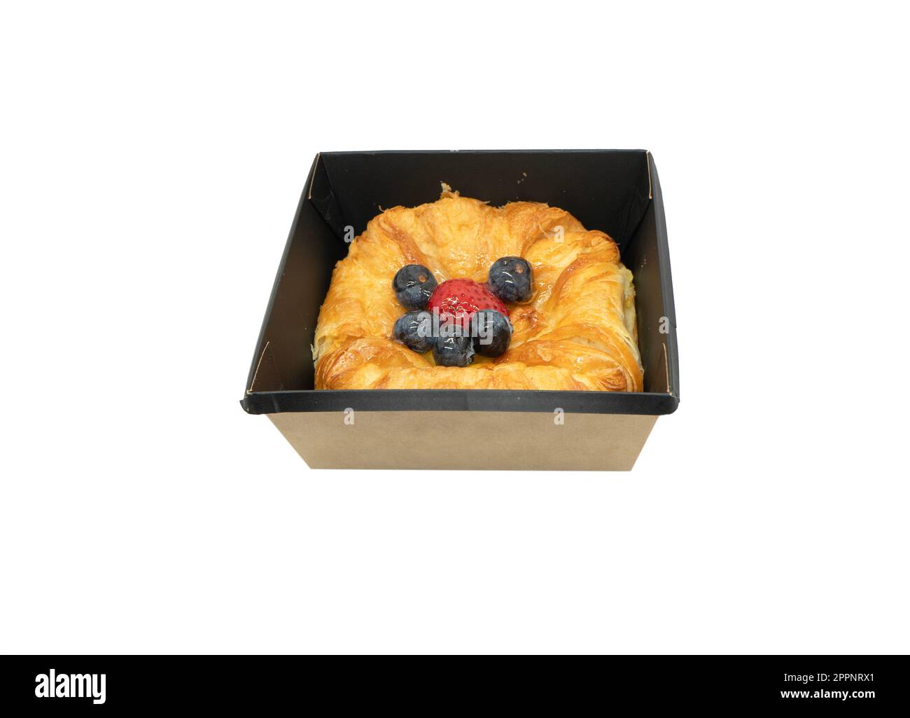 Fresh baked croissant in paper box isolated on white background ...