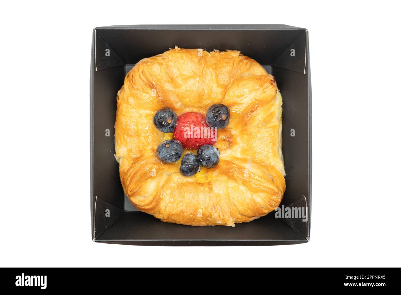 Fresh baked croissant in paper box isolated on white background ...