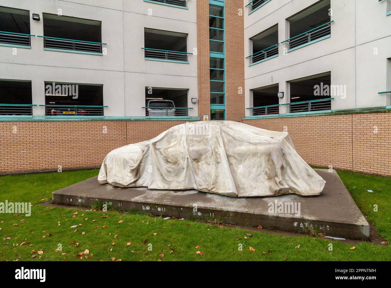 Catalyst Car Sculpture a draped life-sized car that has been cast in ...