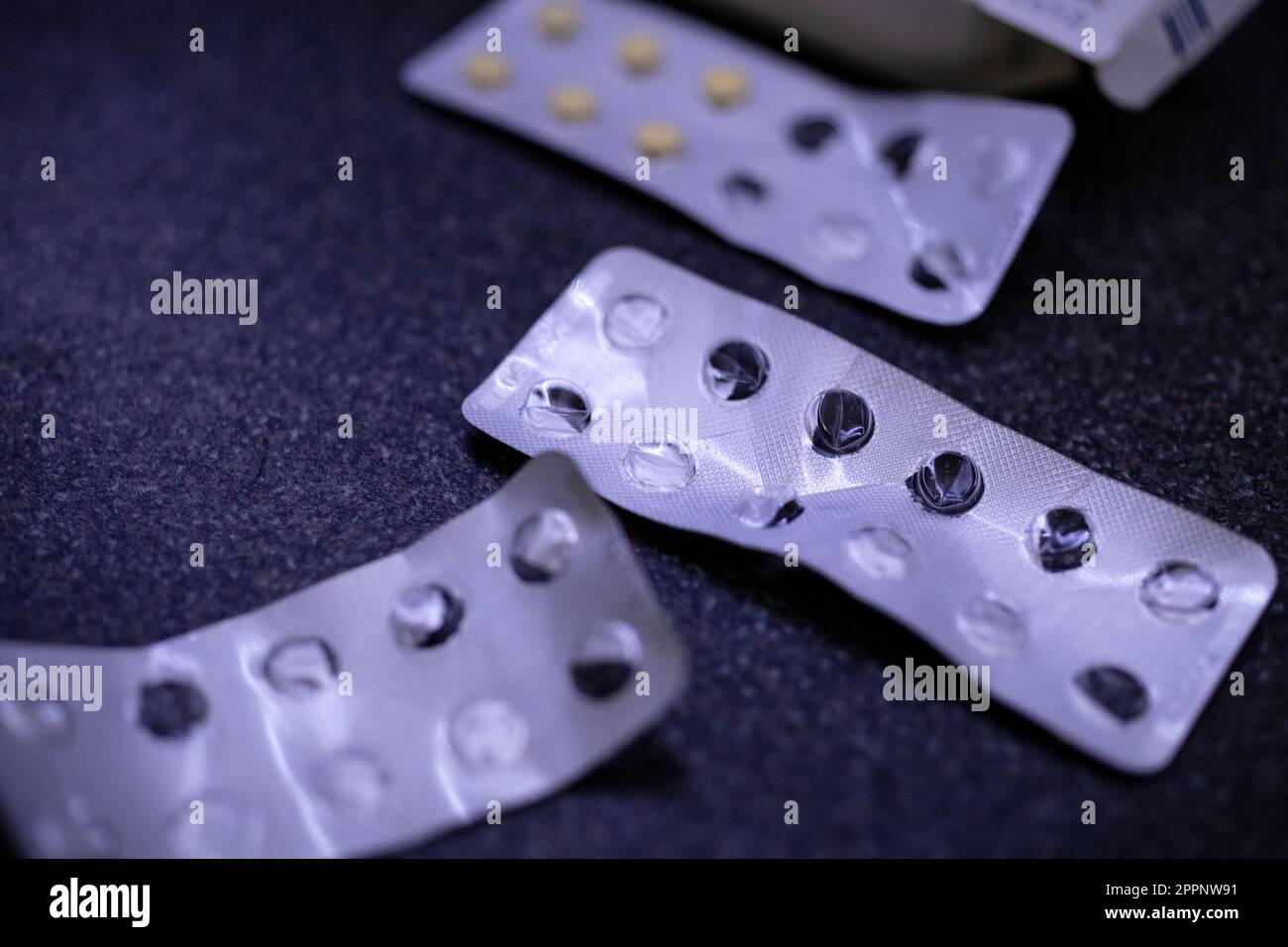 Empty pill packets discarded on worktop, rubbish trash Stock Photo - Alamy
