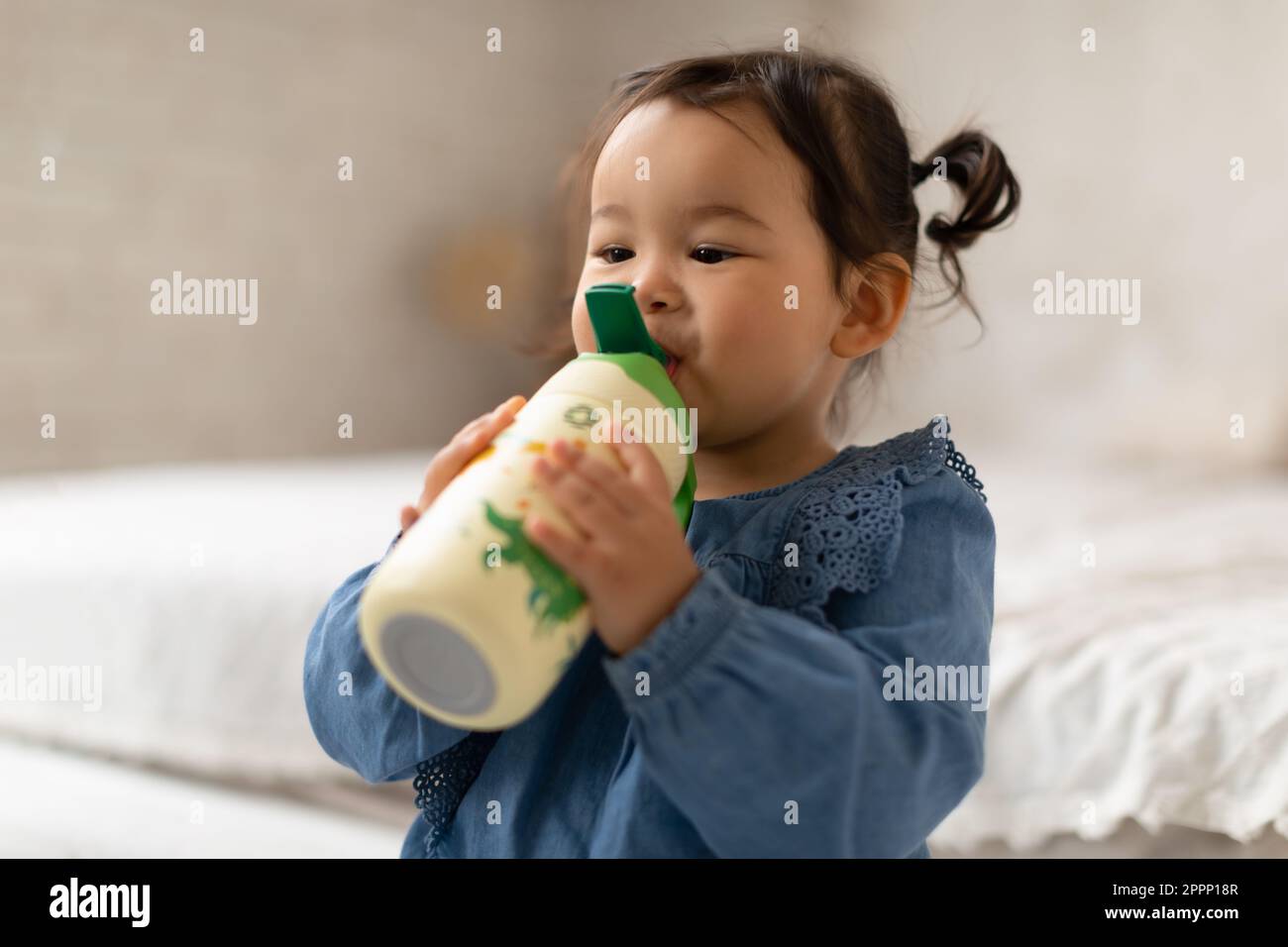 Cute Baby Girl Drinking Bottle