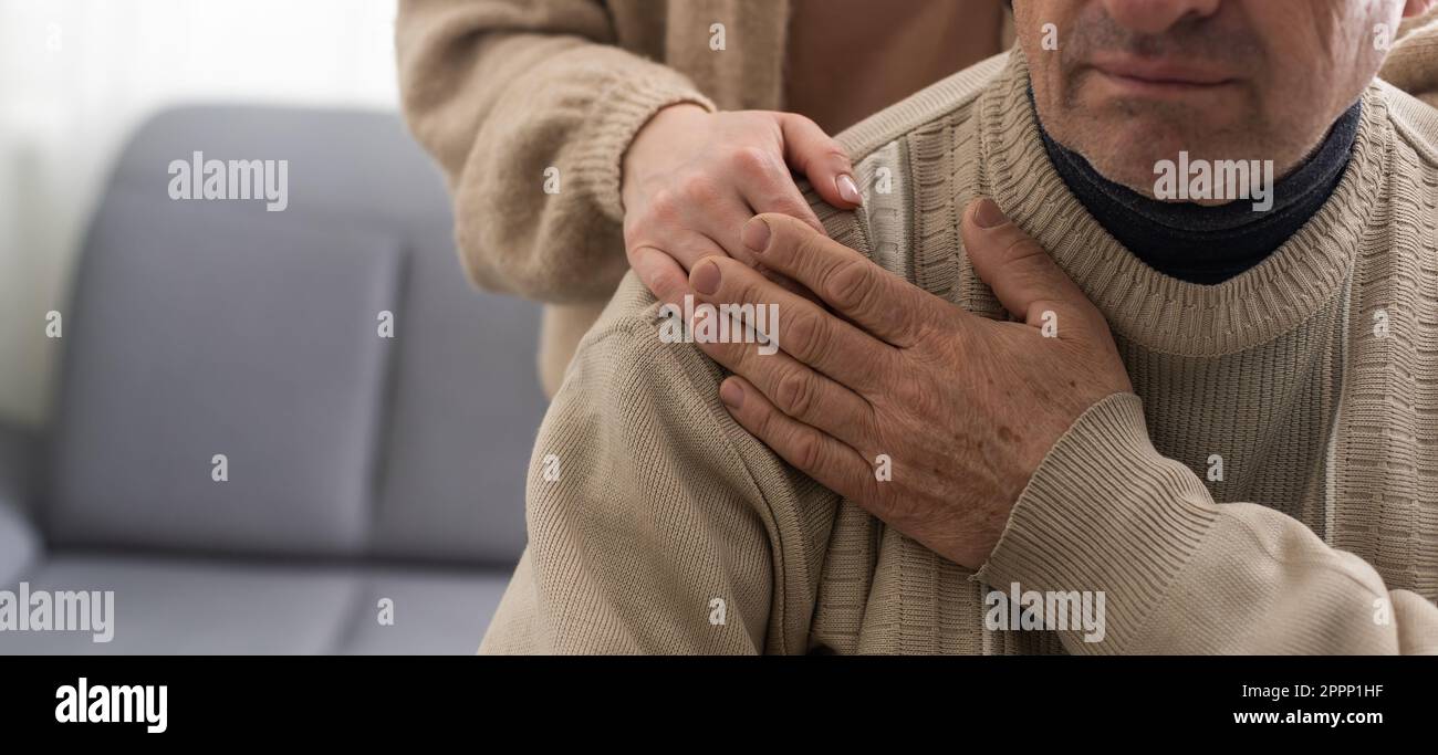 Two people holding hand together. elderly man and support woman Stock ...