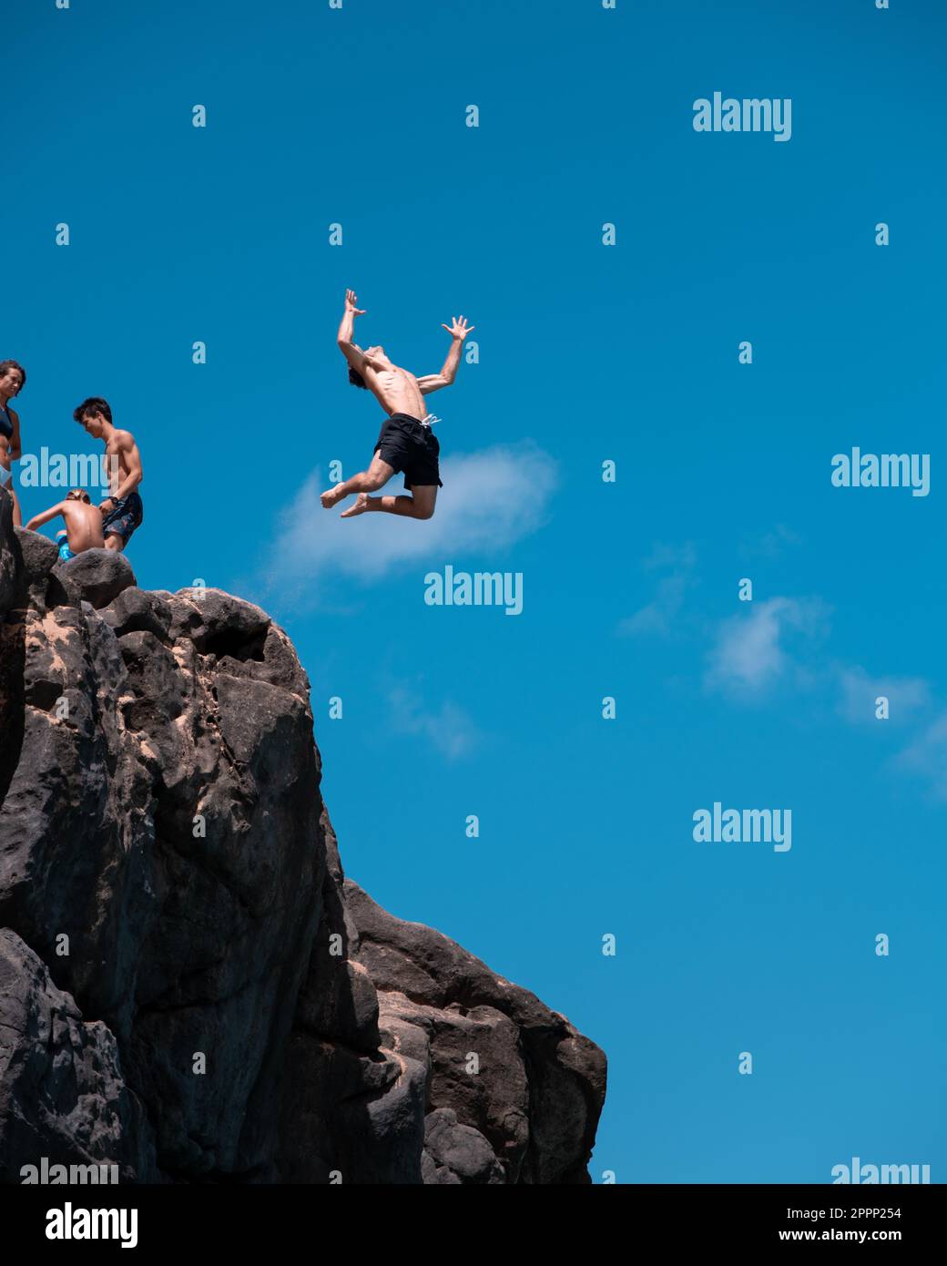 Person Diving Off Cliff