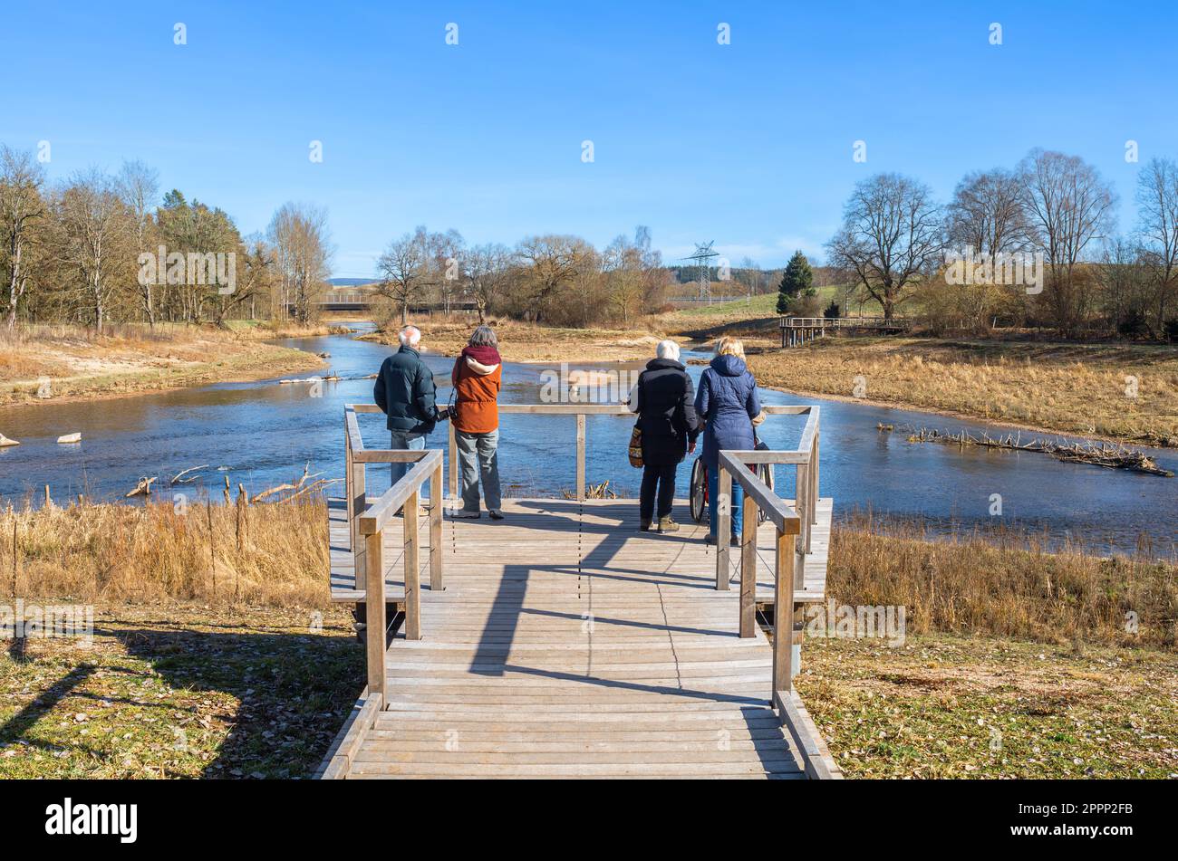 Tourists admiring the confluence of the rivers Brigach and Breg, which ...