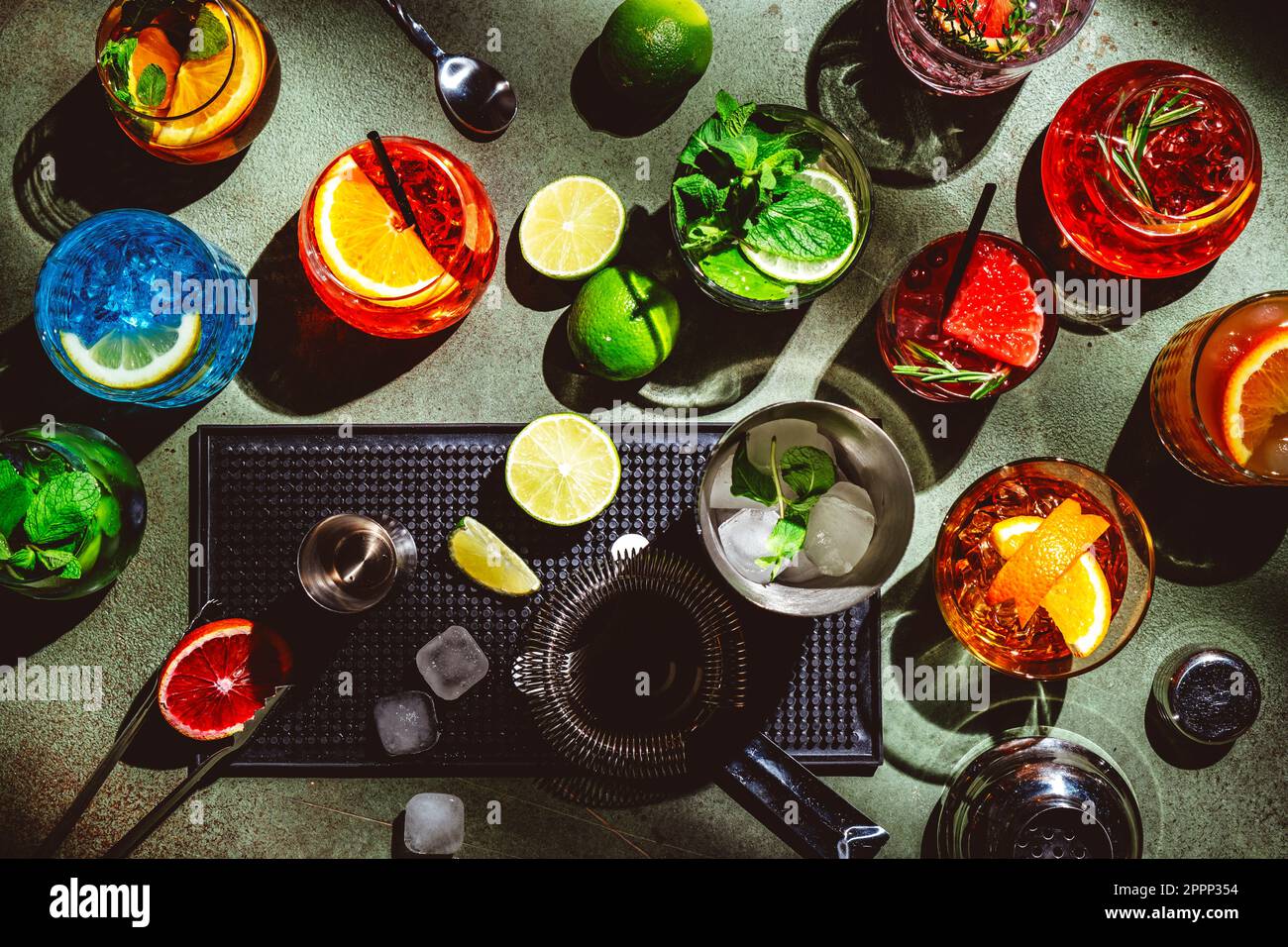 Cocktails set on rusty green bar counter, top view. Mixology concept ...