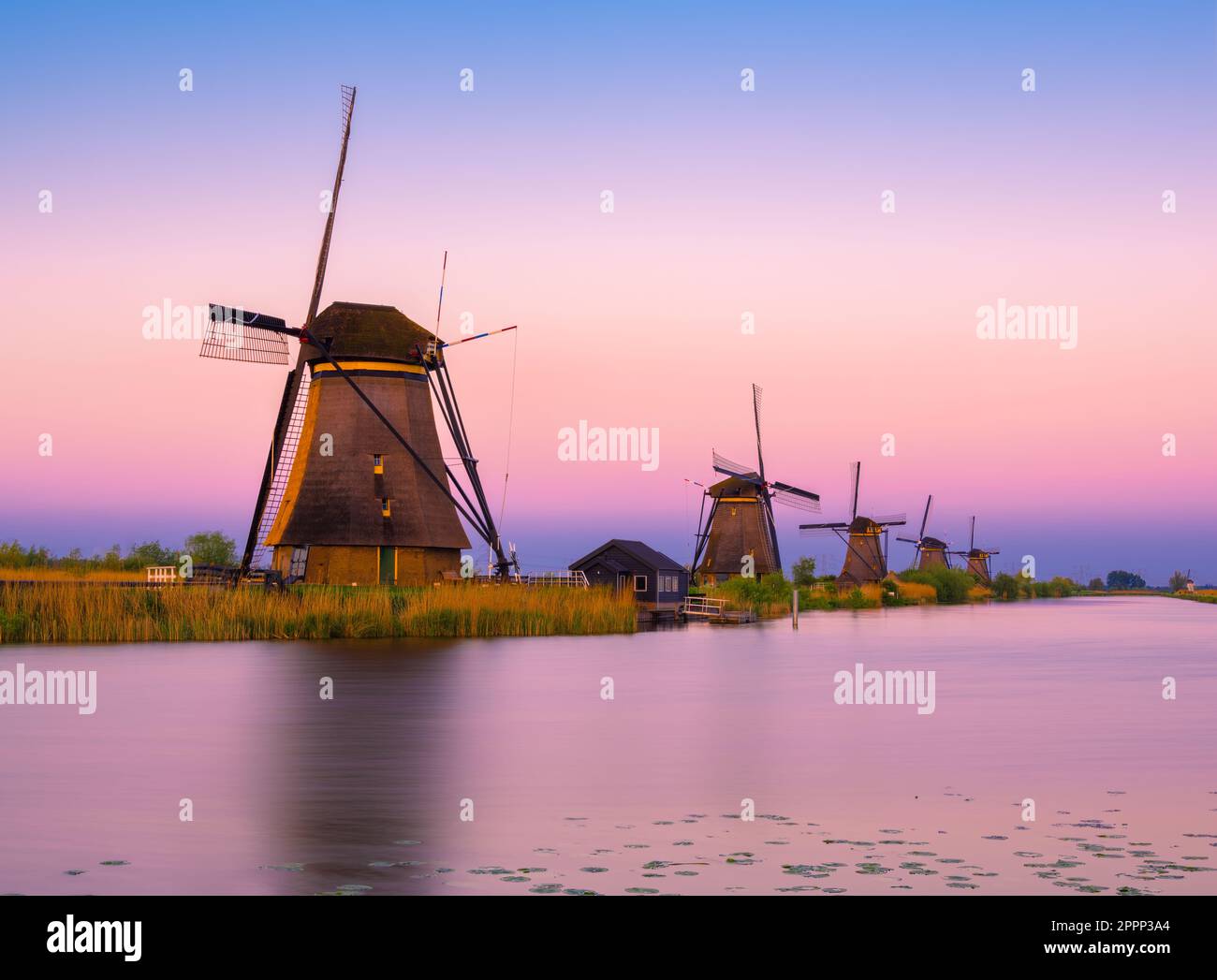The windmills at Kinderdijk are a group of 19 monumental windmills in ...