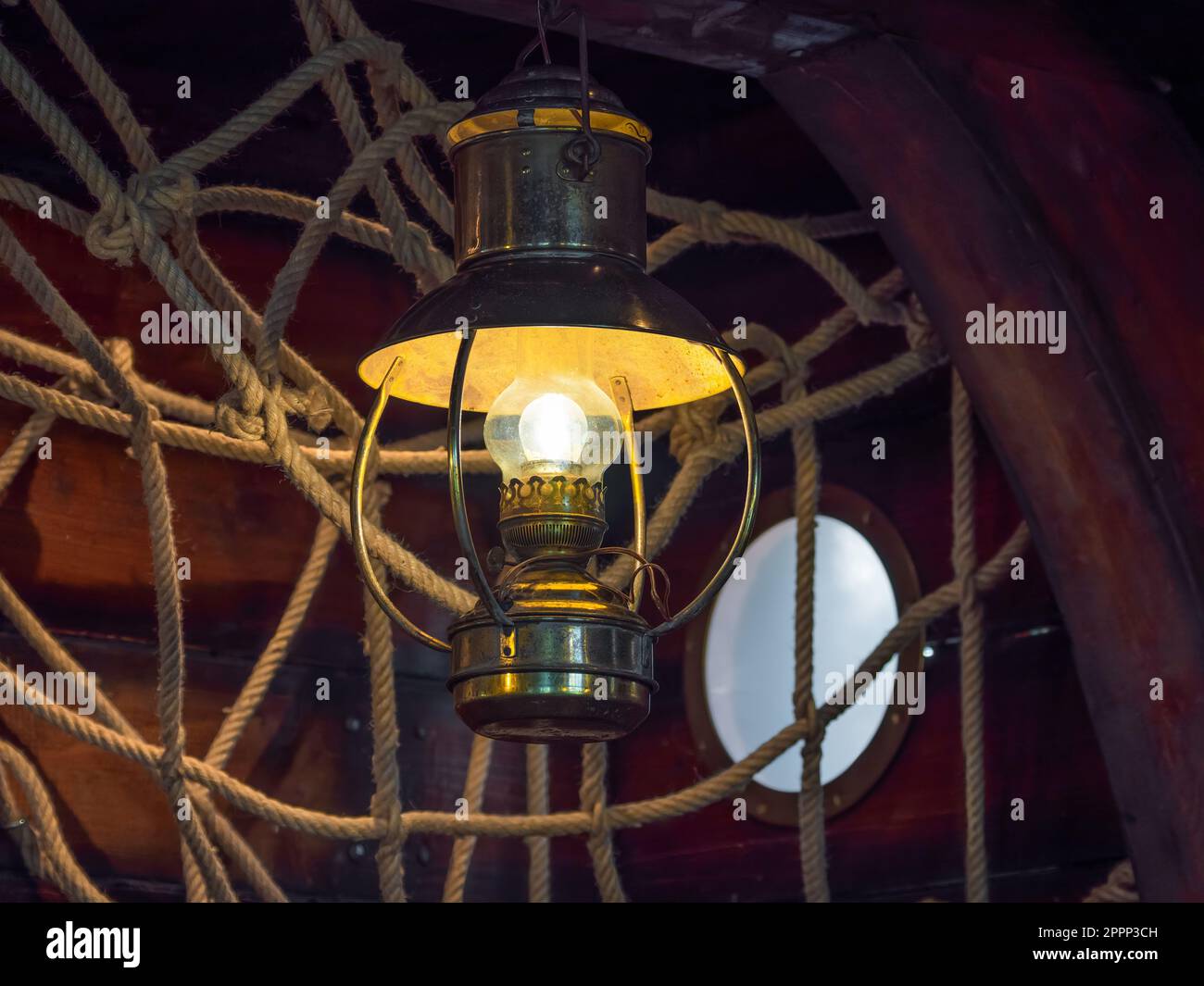 A vintage fishing boat with an old cabin interior lit by retro lighting ...