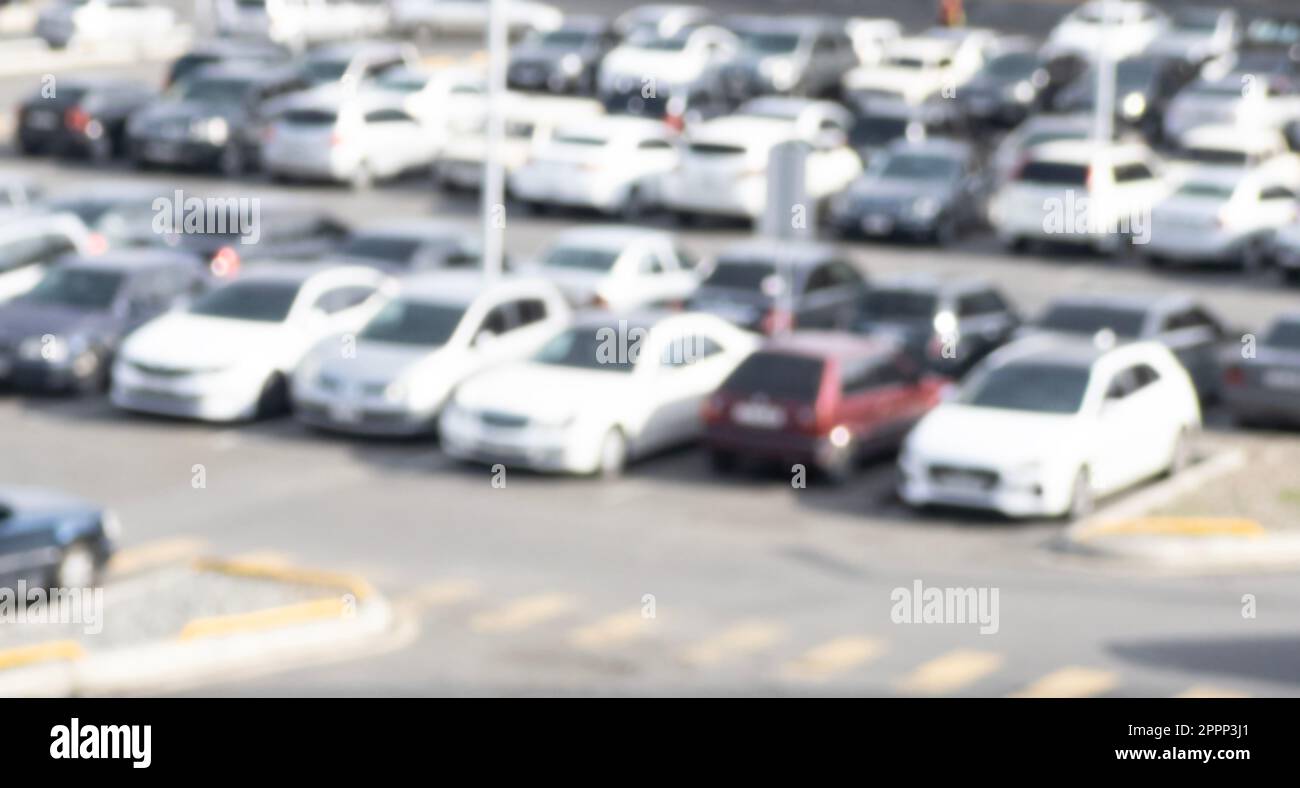 Aerial view blurred cars in car parking lot in shopping mall. Bokeh ...