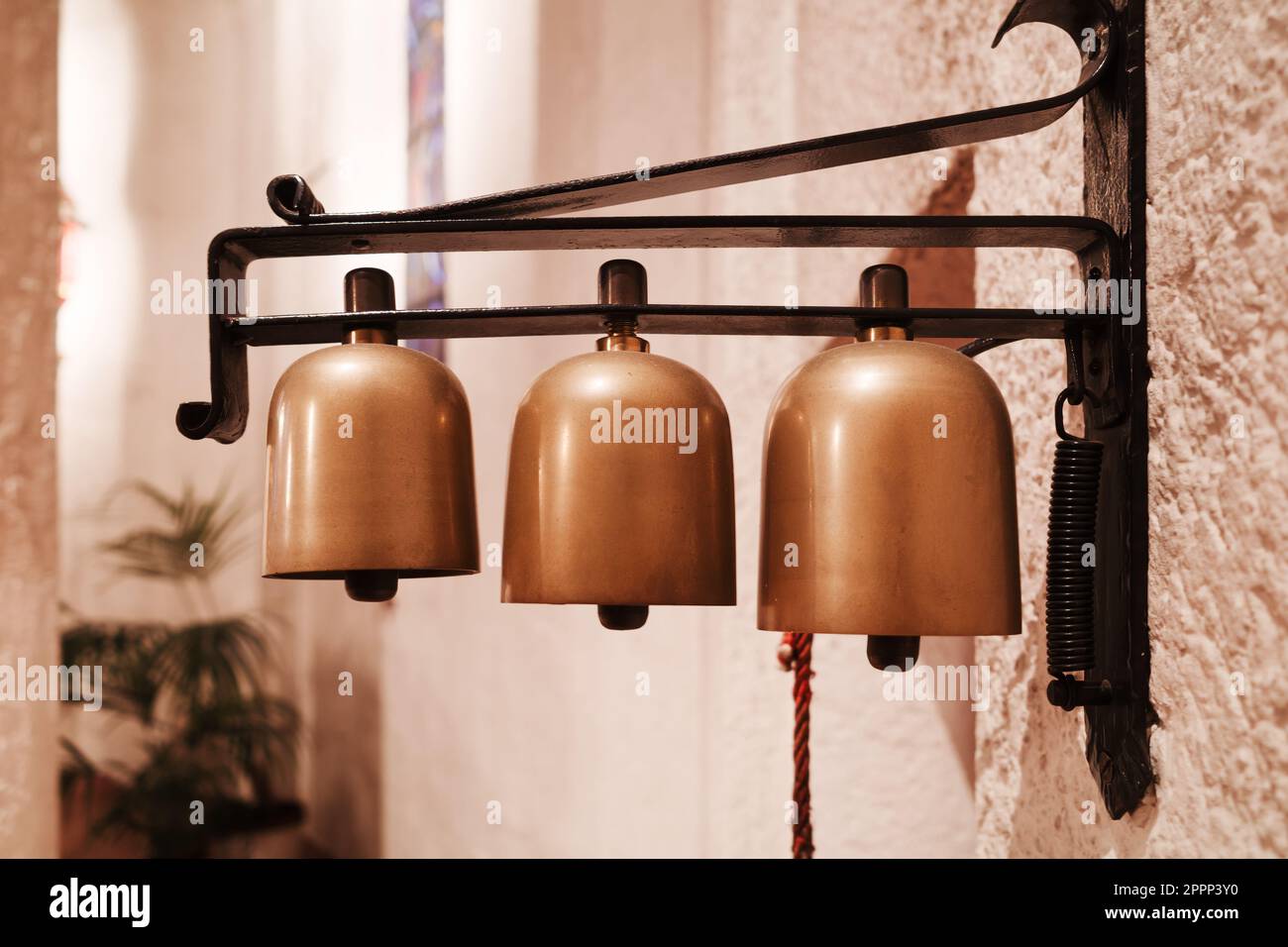 Three little bells in the church to serve at the liturgical ceremonies ...