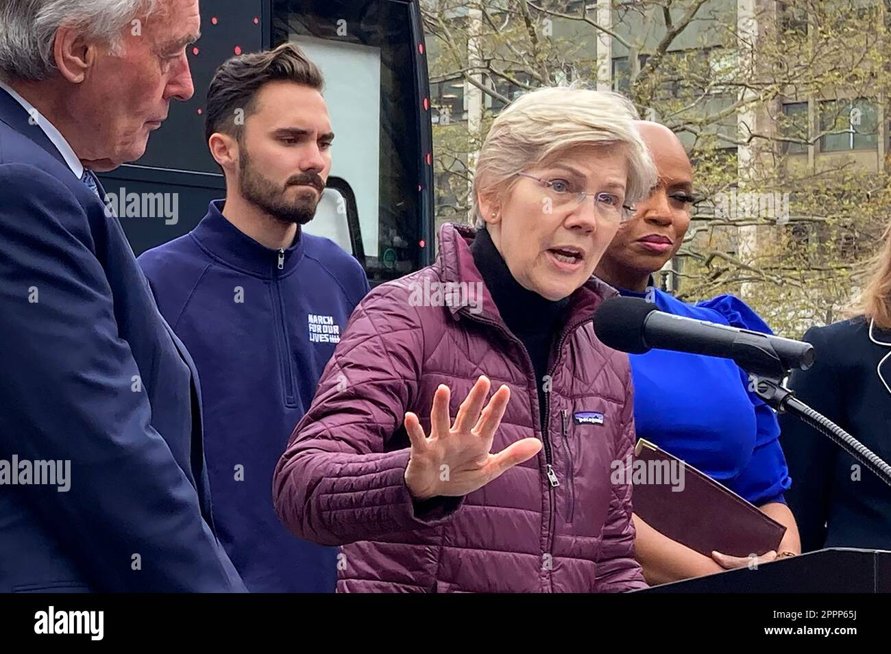 U.S. Sen. Elizabeth Warren, D-Mass., center, faces reporters as Sen ...