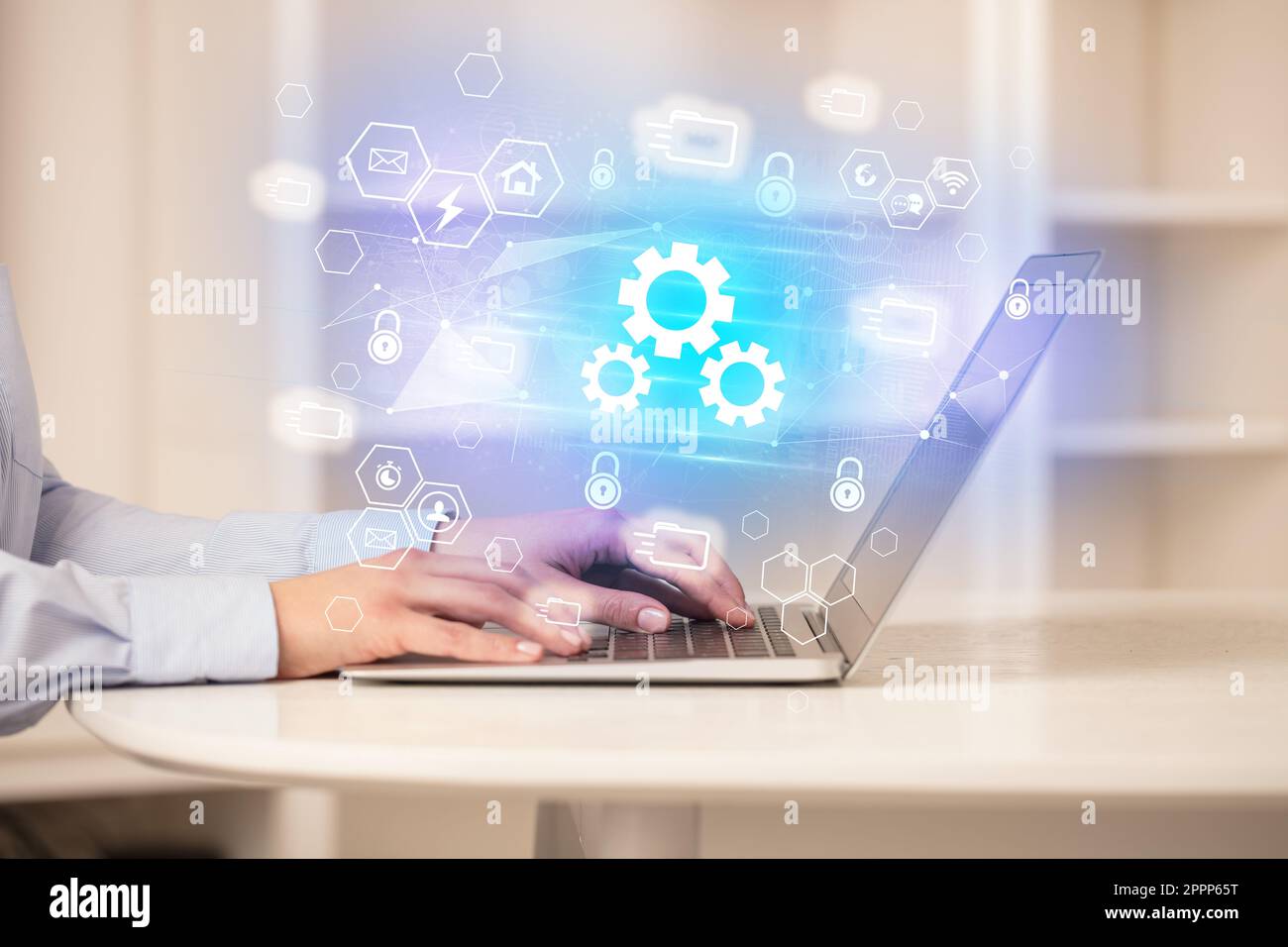 Hands working on laptop with digital icons Stock Photo - Alamy