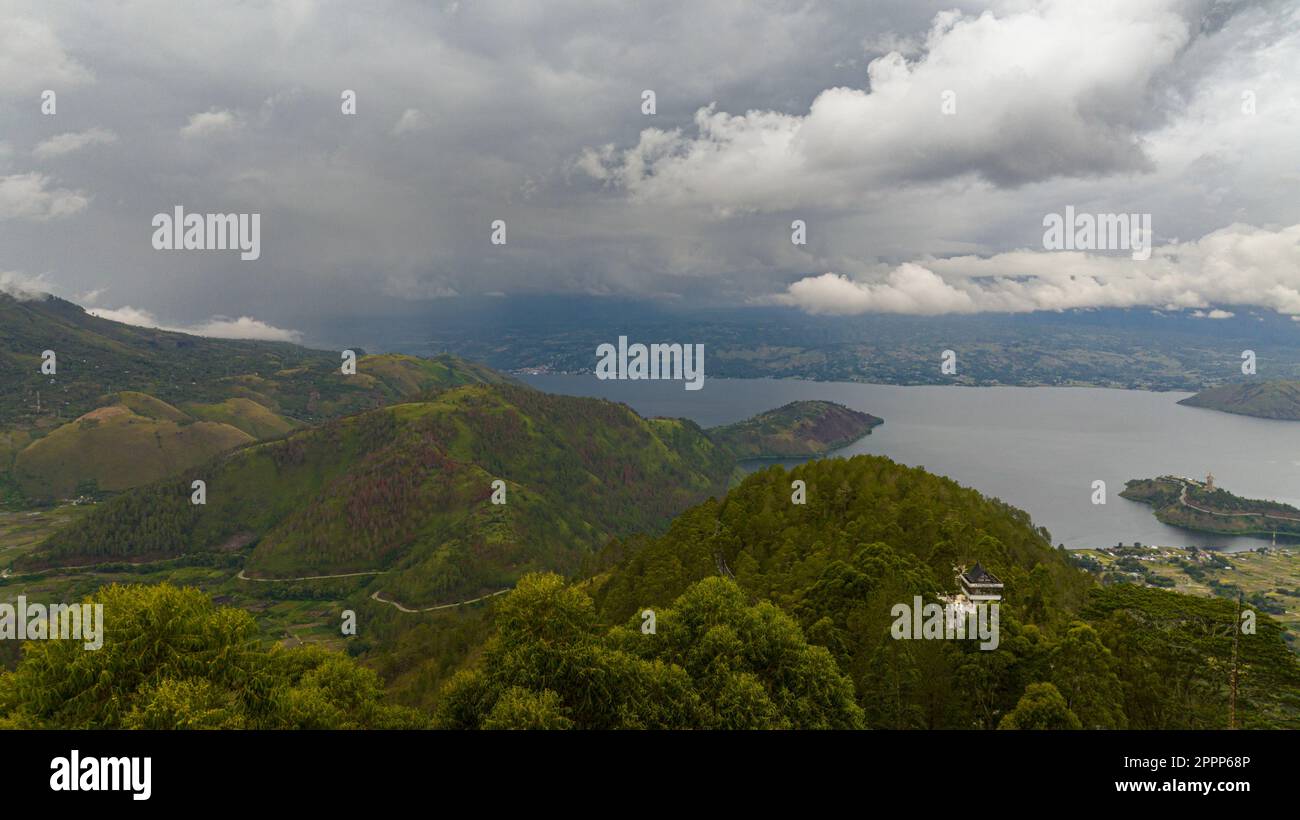 Lake Toba and Samosir island among the mountains with tropical ...