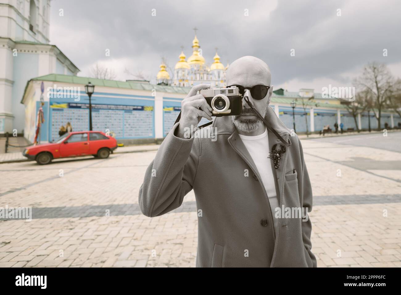 Handsome beard photographer makes pictures on film retro camera in the ...