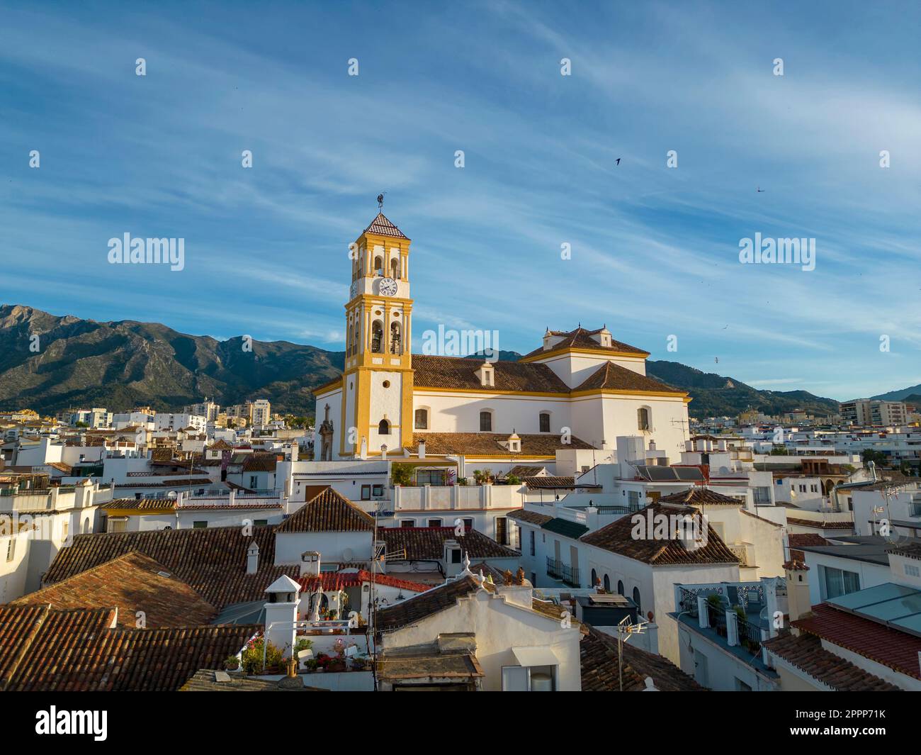 view of the old town of Marbella with sierra blanca in the background ...