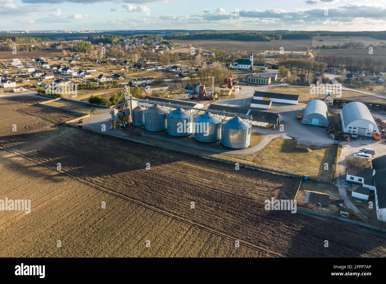 aerial panoramic view on agro-industrial complex with silos and grain ...