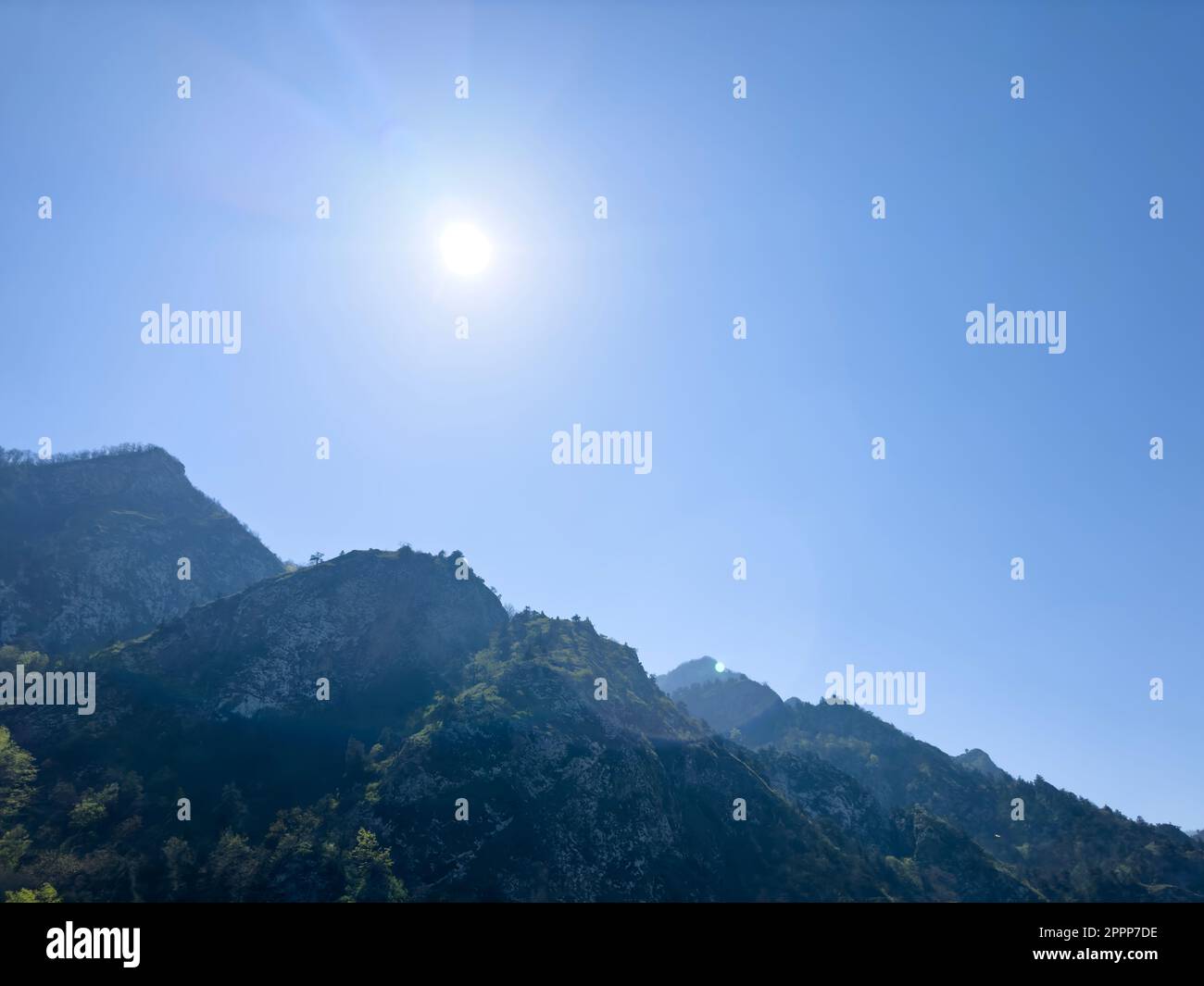 Scenic aerial mountain view to green forest valley in sunlight among ...